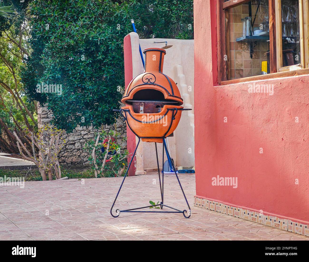 Traditional Moroccan Berber barbecue clay grill stove standing outdoors ...