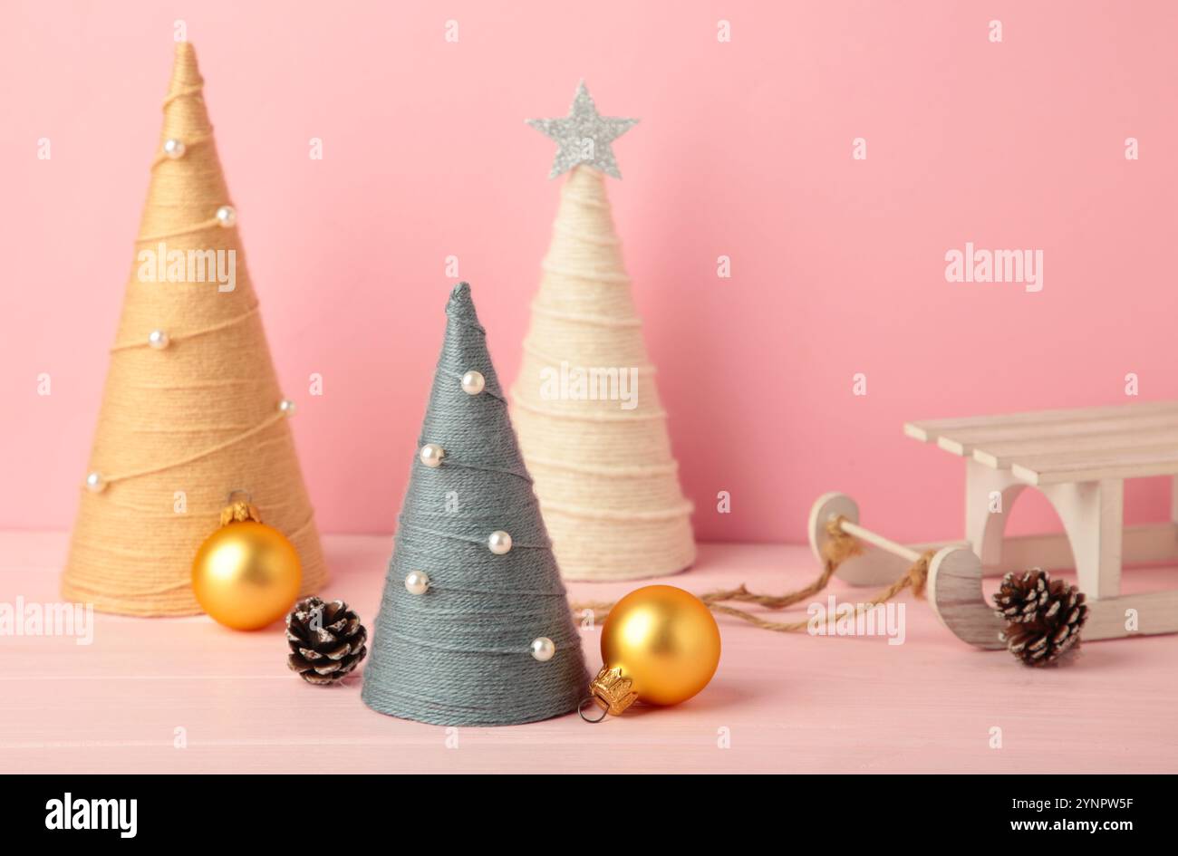 Handmade Christmas trees. Yarn wrapped cone trees. DIY concept Stock ...