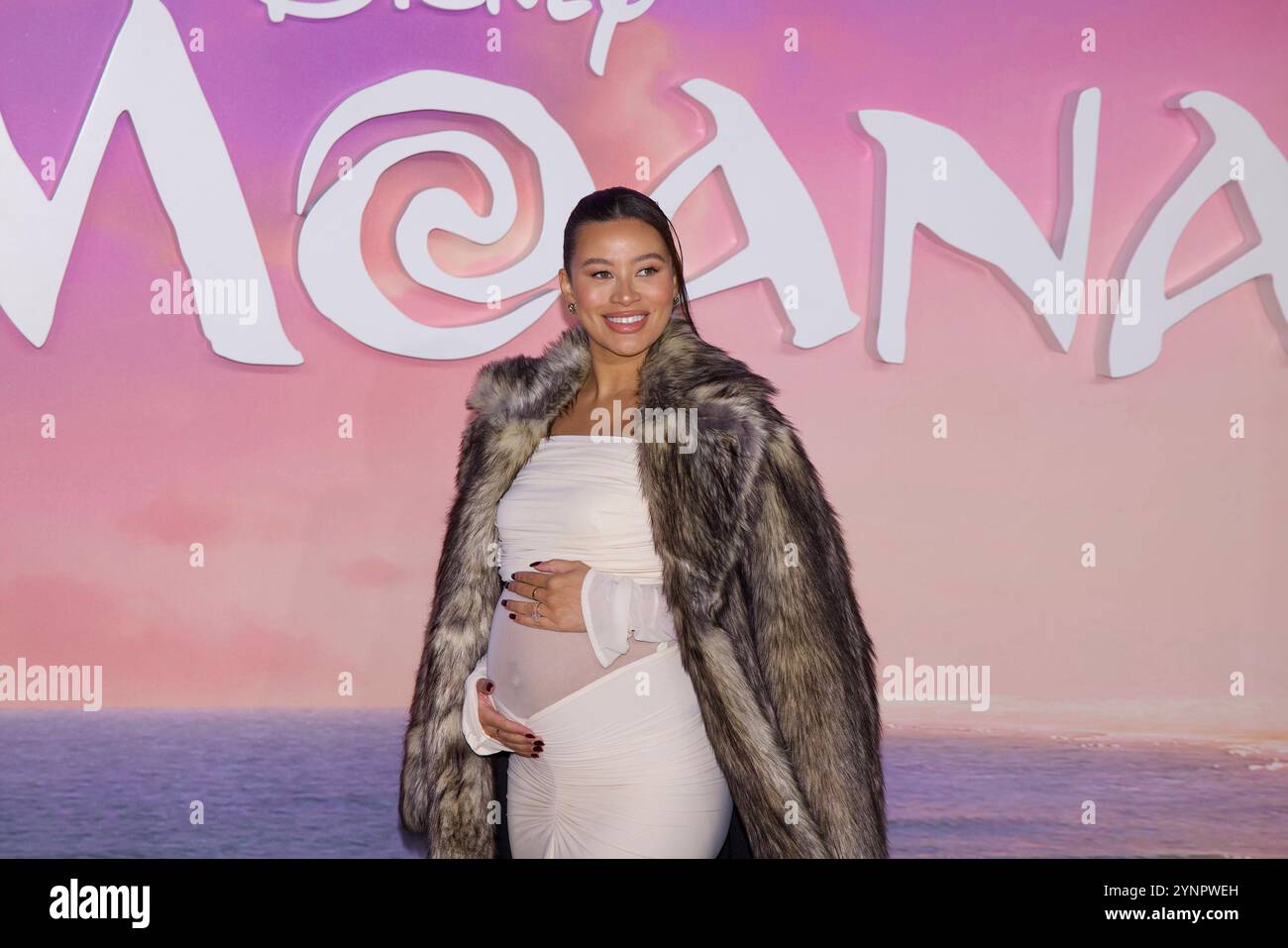 London, UK. Montana Brown (white outfit) at the Moana 2 film premiere ...
