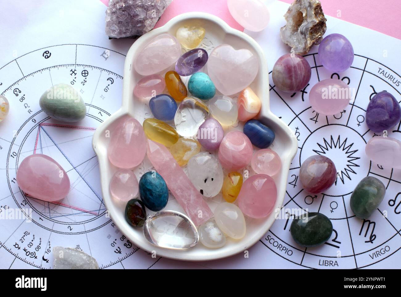 Precious natural stones with a board with symbols of the zodiac signs ...