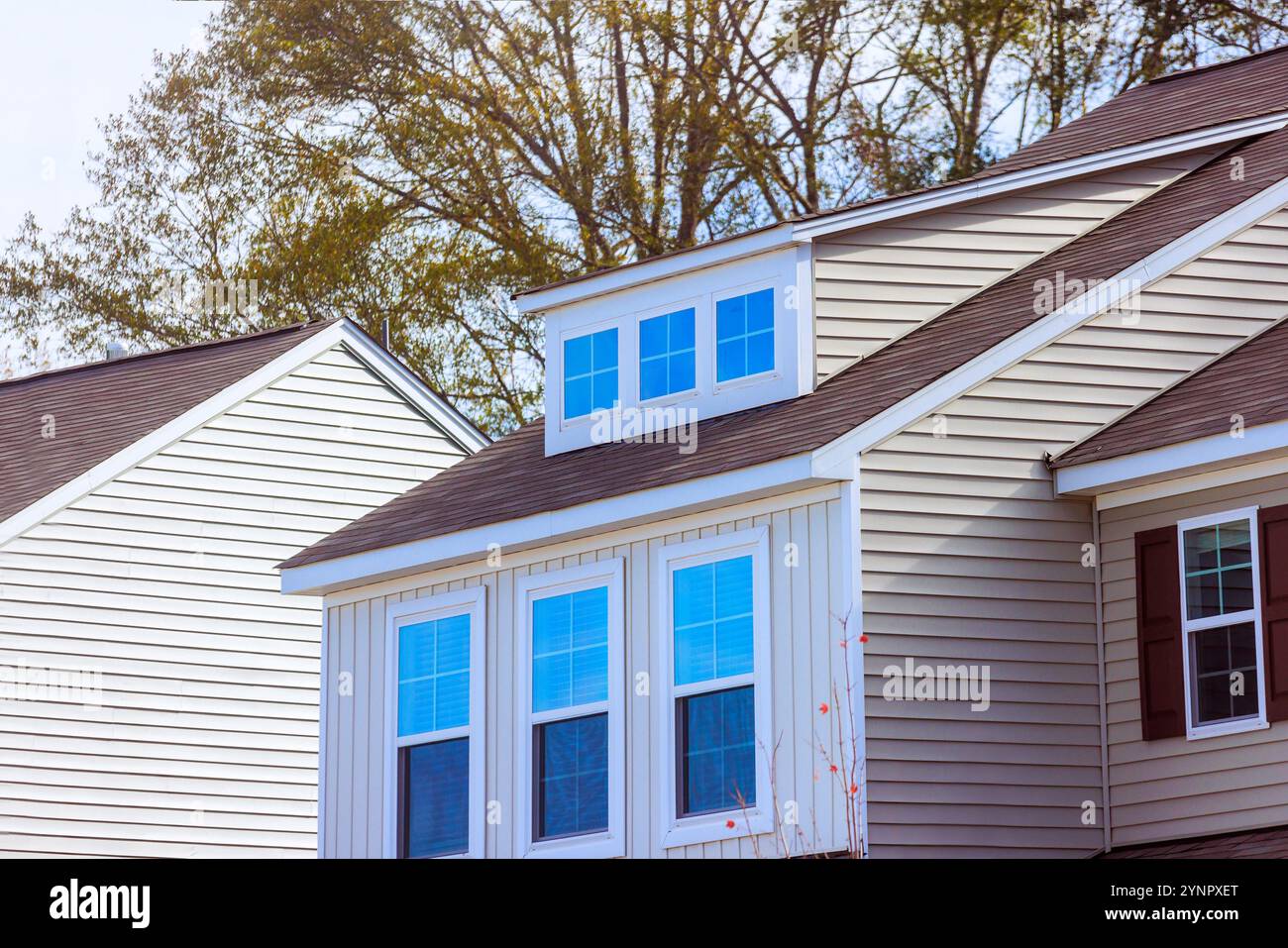 Residential building roof highlights modern windows amid suburban ... Residential building roof highlights modern windows amid suburban ...