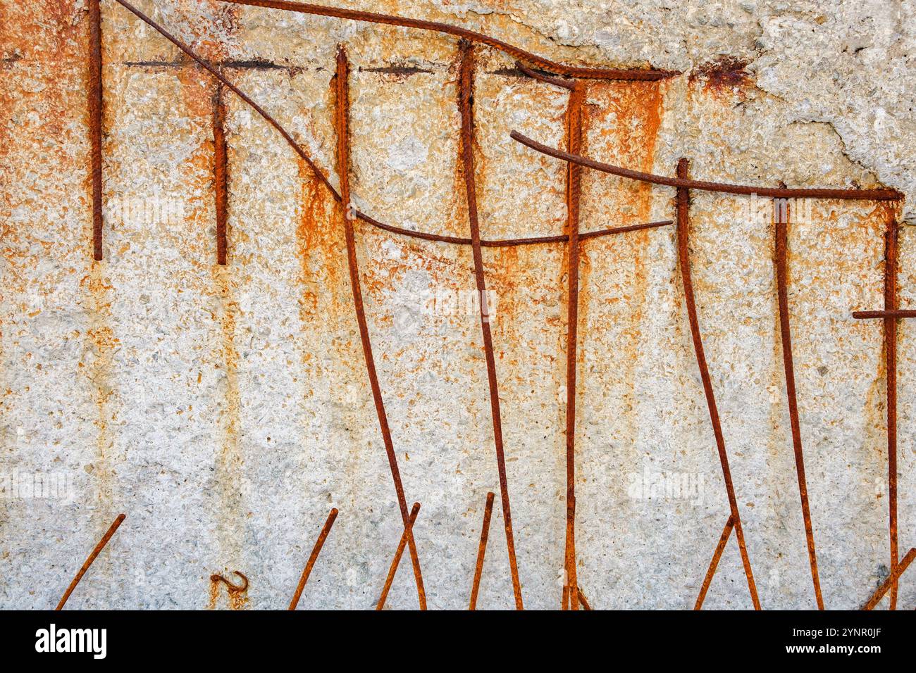 rusty metal fittings sticking out of a concrete wall Stock Photo - Alamy