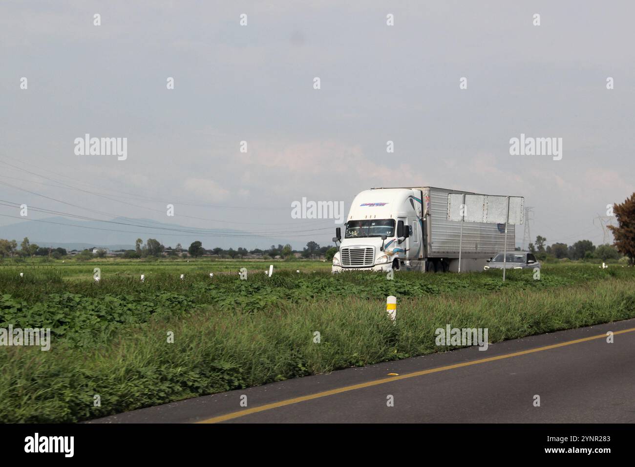 Queretaro, Mexico - Jul 28 2024: Trailers on the Mexican highway suffer ...