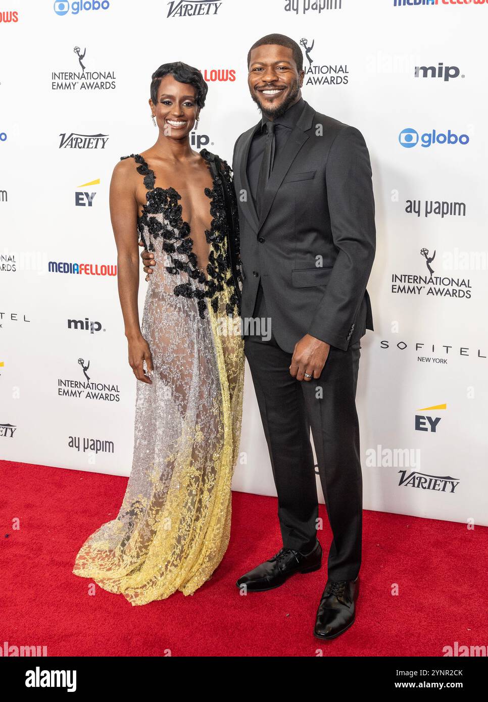 Skye P. Marshall wearing dress by Marco and Maria and Edwin Hodge ...