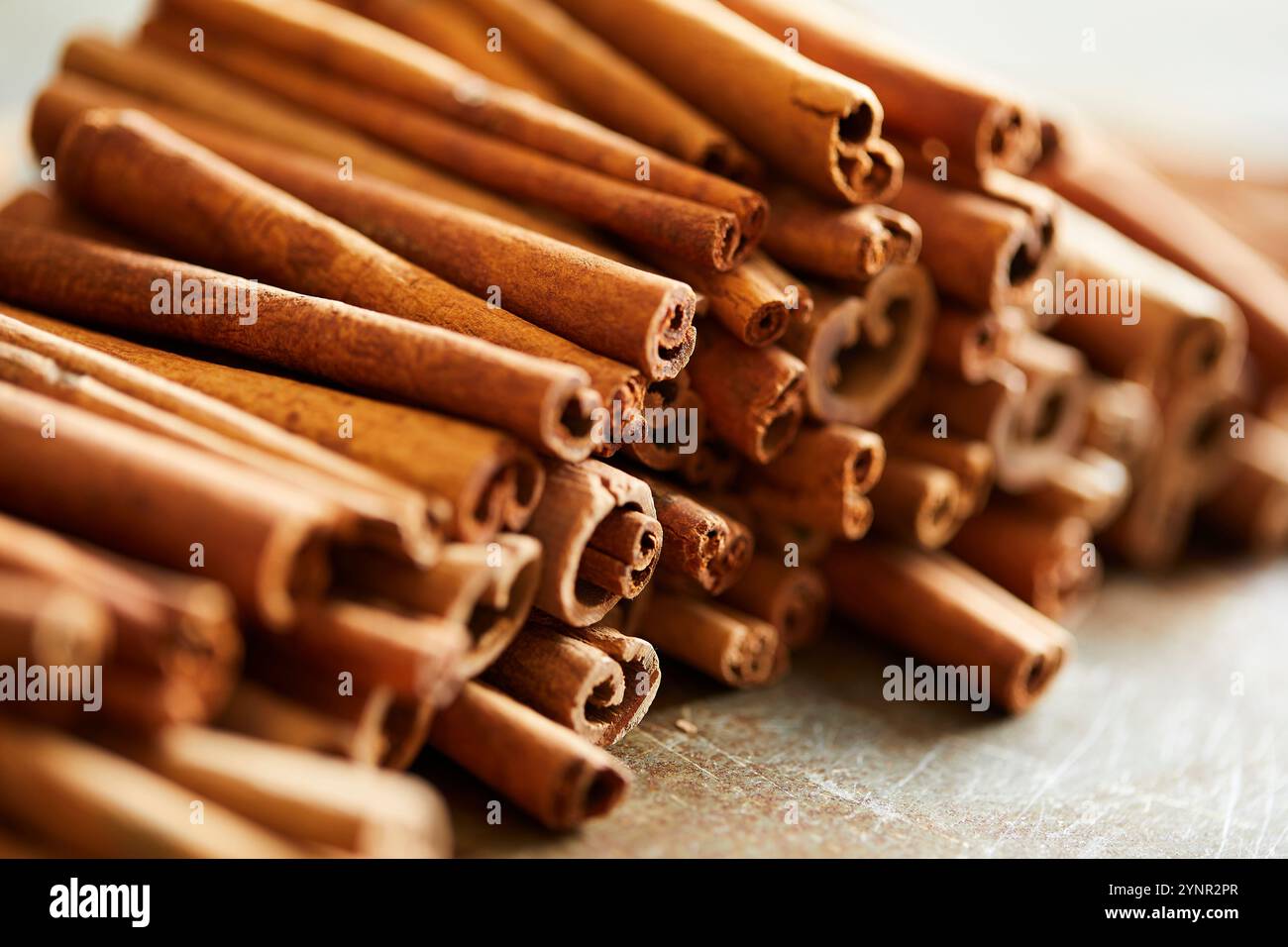 Cinnamon sticks stacked Stock Photo - Alamy