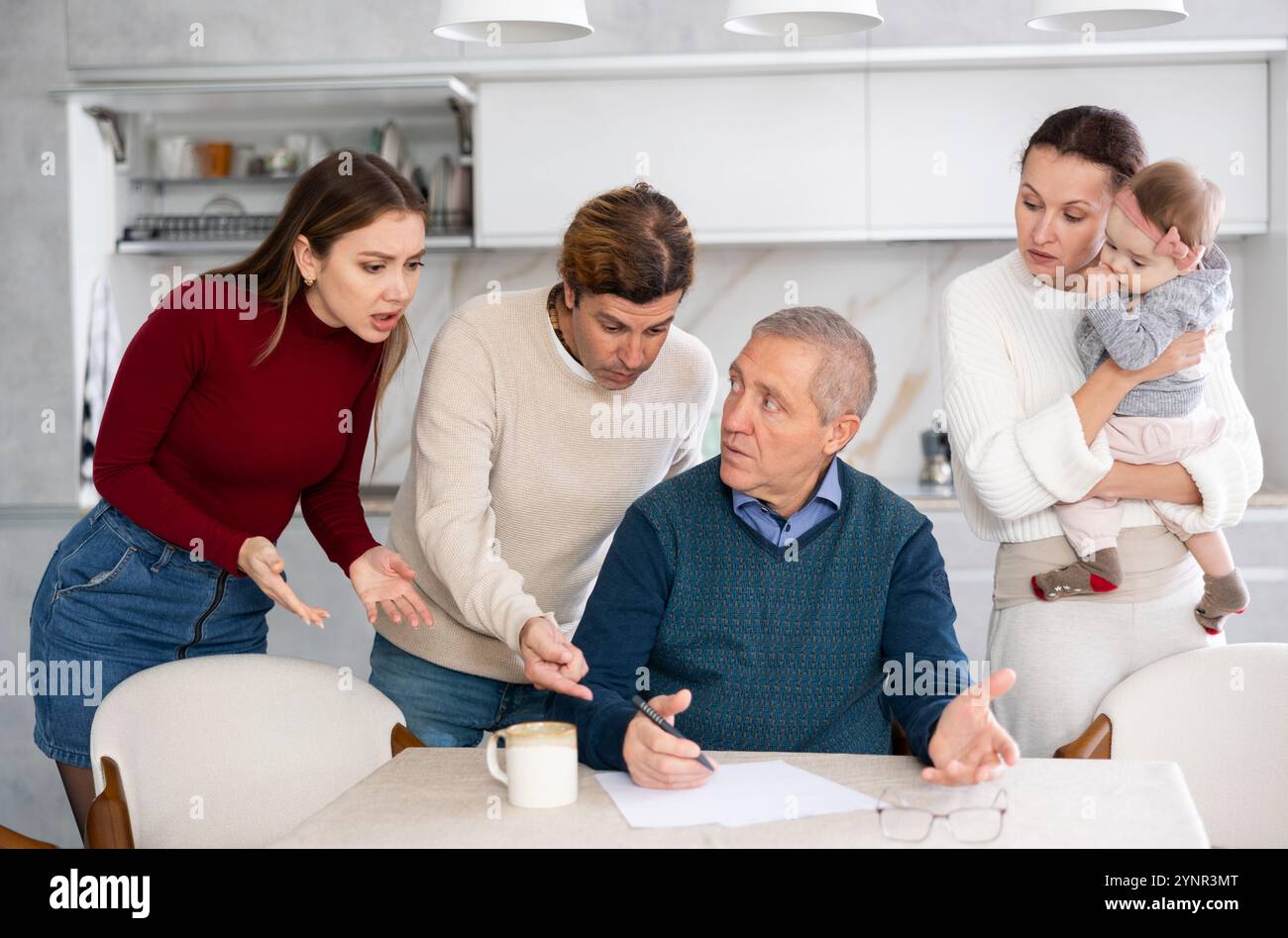 Family of different ages arguing while filling out important documents ...