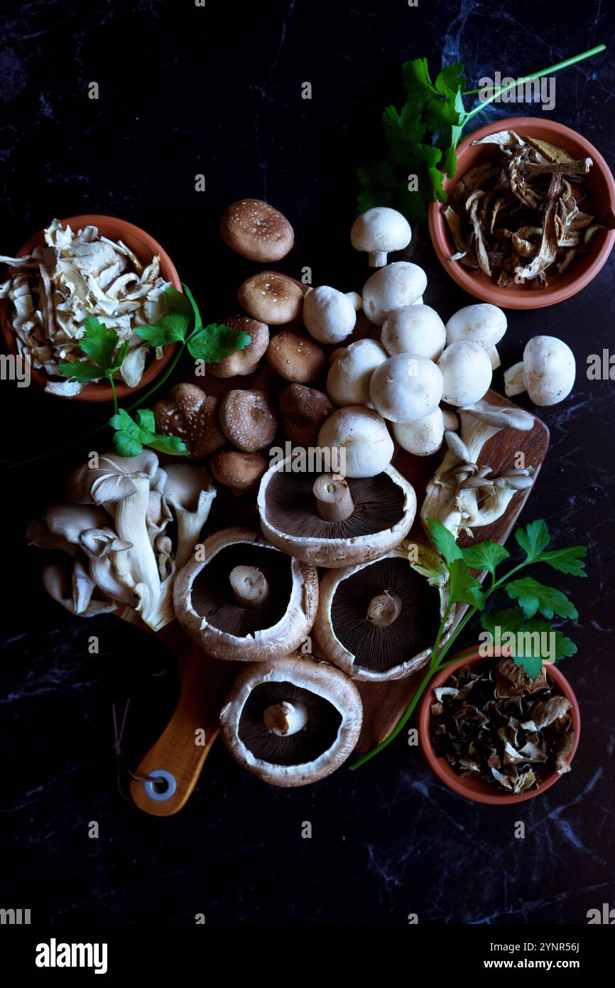 Selection of mushrooms including fresh portobello, shiitake, white cup ...