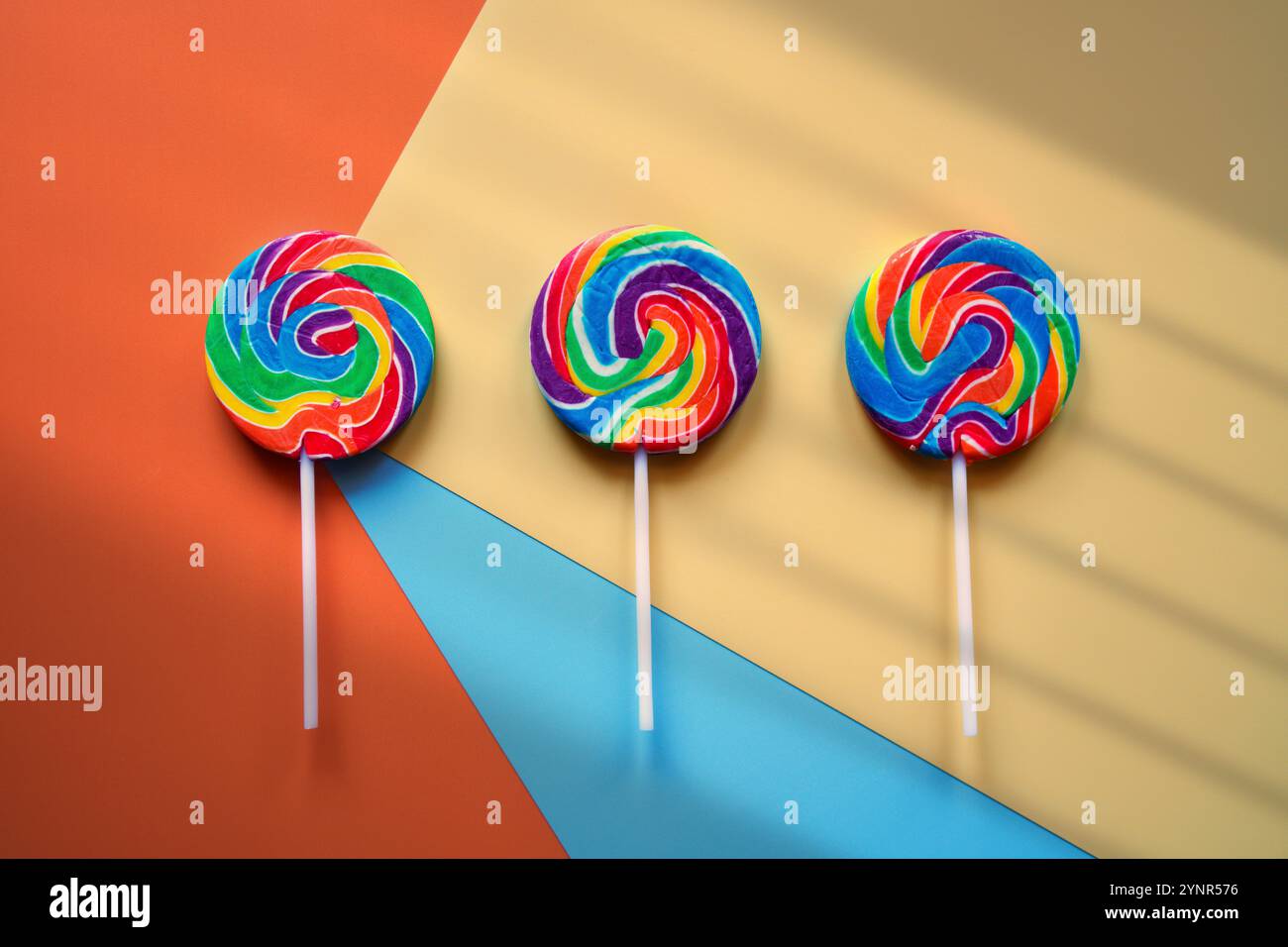 Lollipops with modern color blocking aesthetic Stock Photo - Alamy