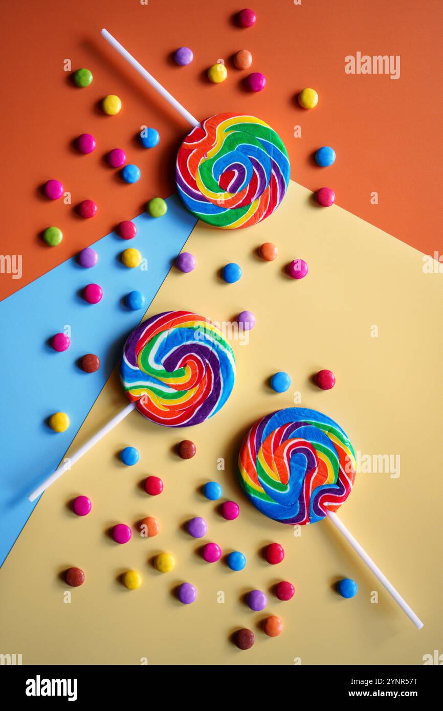 Lollipops and candy with modern color blocking aesthetic Stock Photo ...