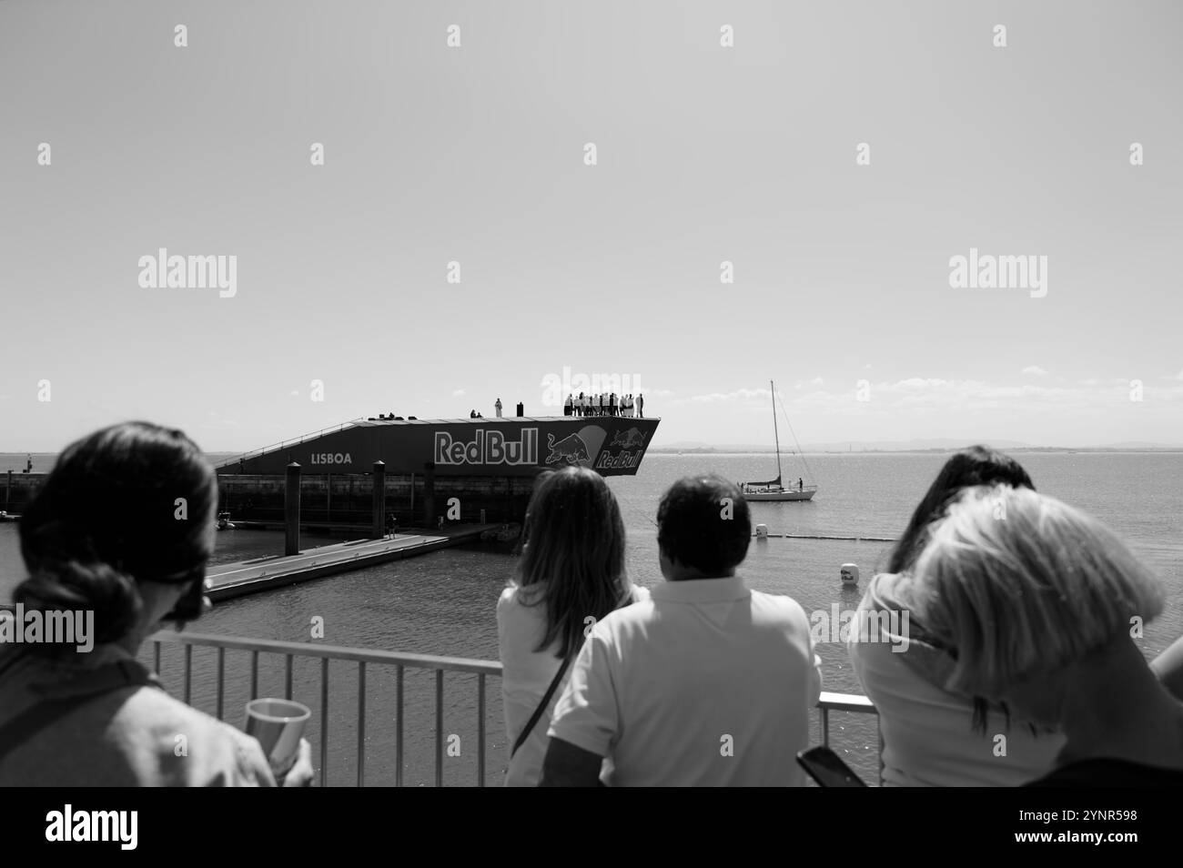 Monochrome of spectators watching the iconic Red Bull Flugtag ramp with ...