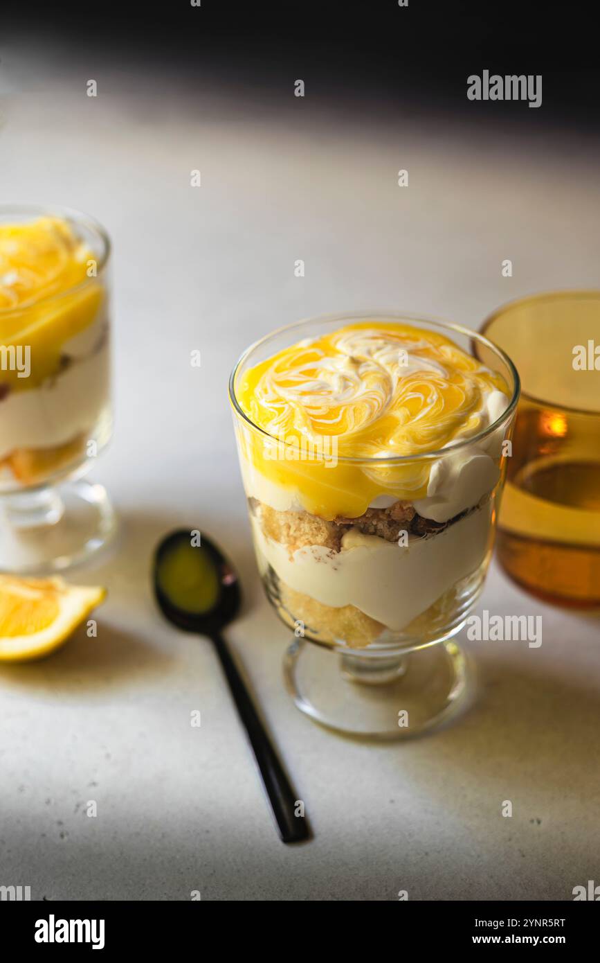 individual lemon trifles in a dessert glass Stock Photo - Alamy