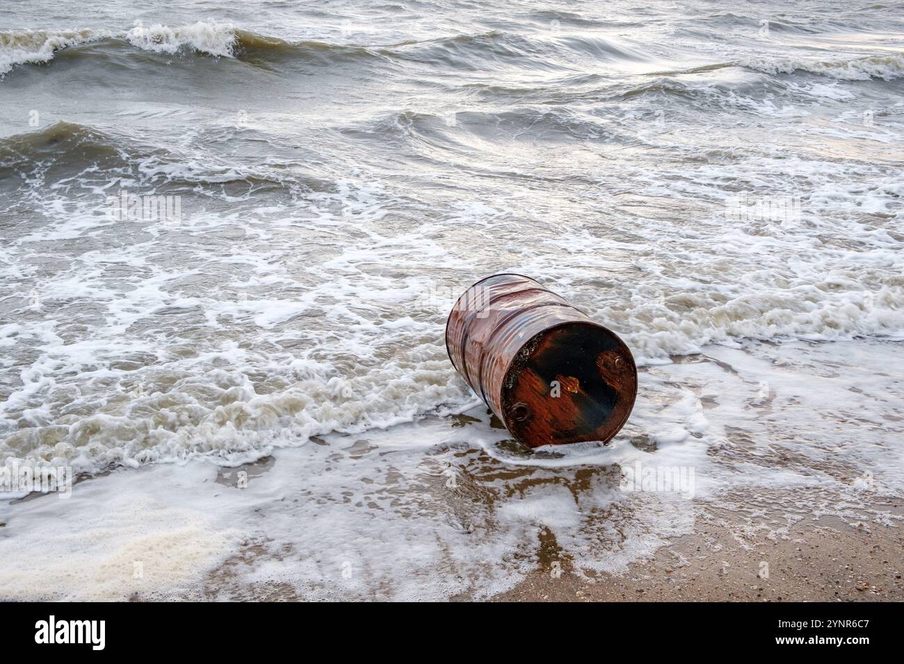 rusty metal barrel was carried out by storm to seashore Stock Photo - Alamy