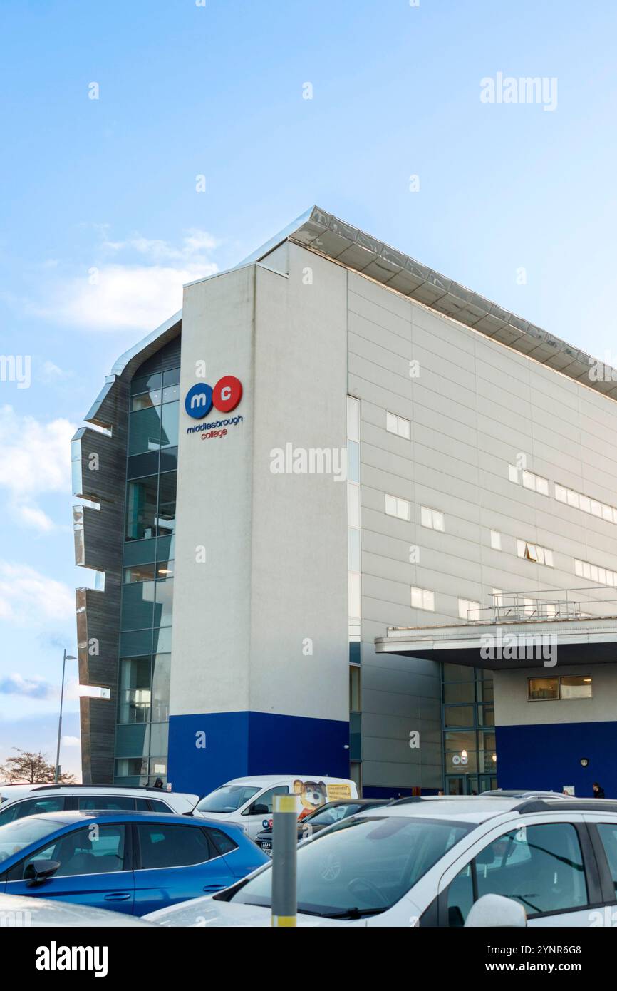 Modern Middlesbrough college building with logo and parked cars under a ...