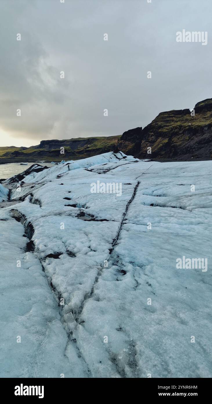 Glacier lagoon with massive ice cap creating vatnajokull chain with ...