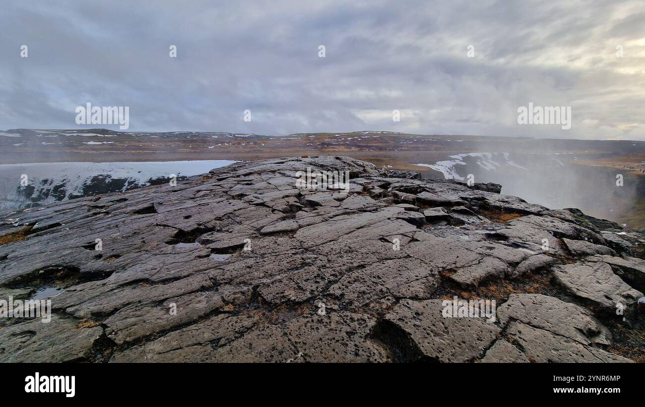 Massive river stream falling down hillside and edges in Icelandic ...