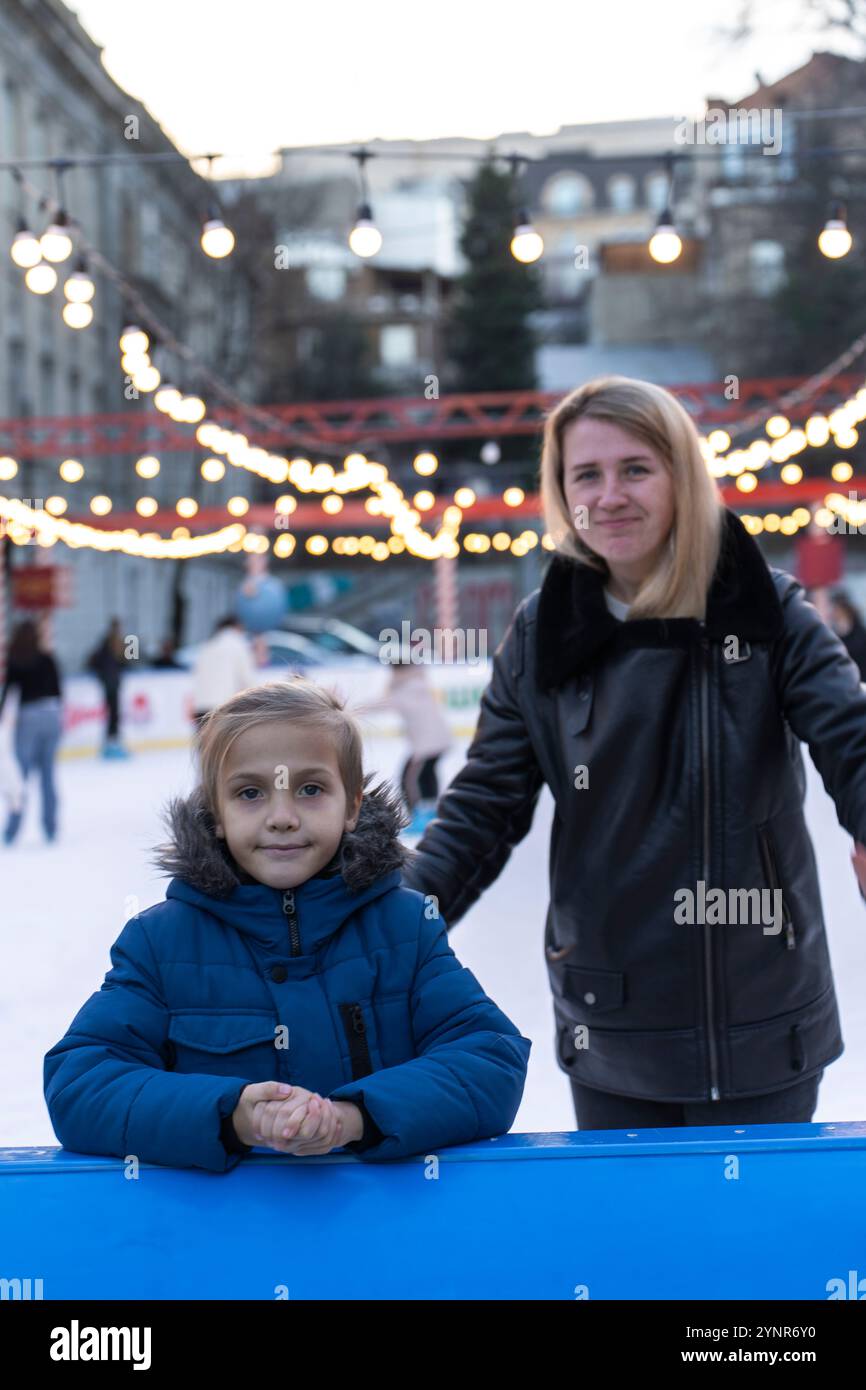 ice rink, skating, mother and child, winter fun, ice skating, festive ...