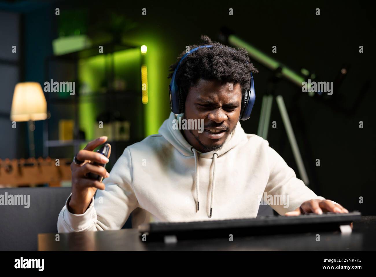 African american player shouting after failing to win videogame while ...