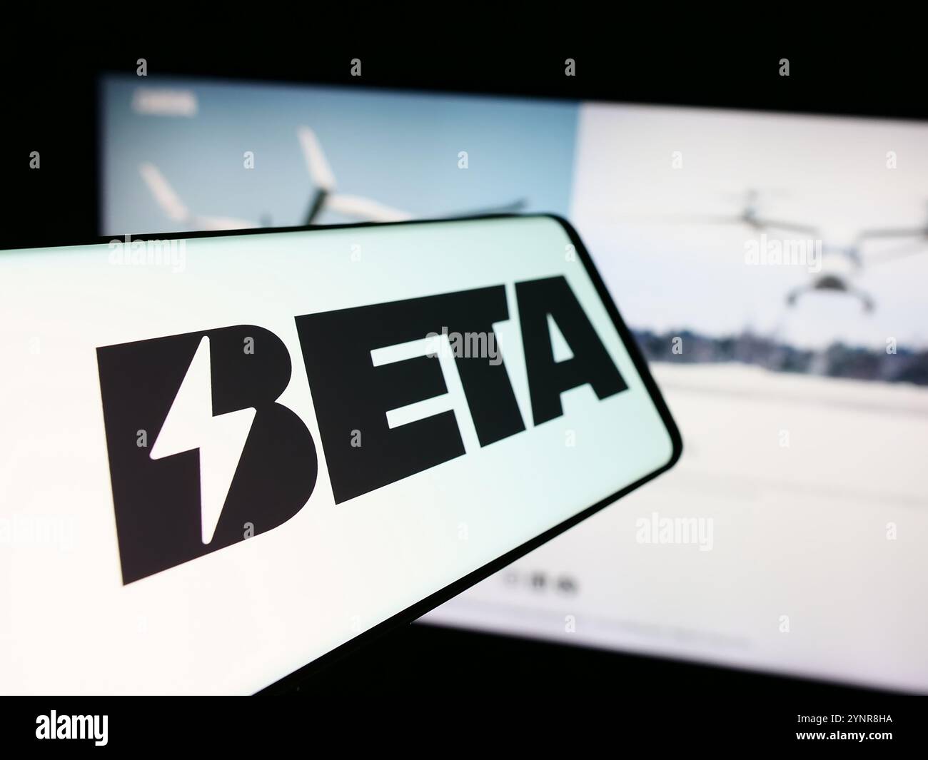 In this photo illustration, a cellphone with the logo of American eVTOL ...