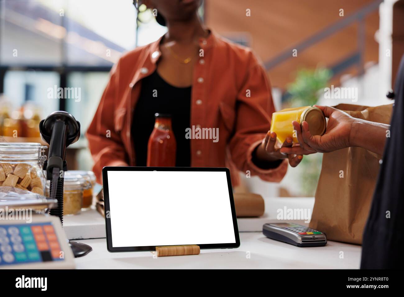 Detailed shot of tablet placed horizontally on counter in sustainable ...