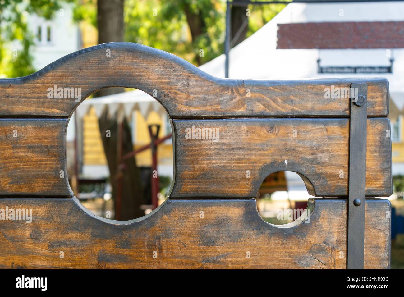 Medieval wooden pillory in a park Stock Photo - Alamy