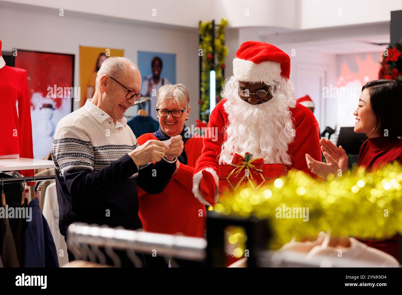 Santa claus giving prize to client, reading raffle contest winner name ...
