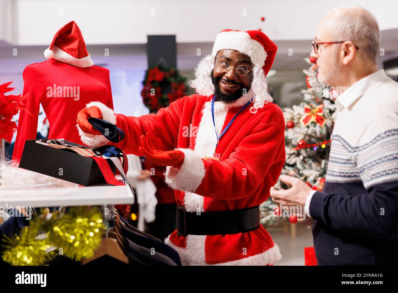 Employee showing ties to customer, recommending accessories and items ...