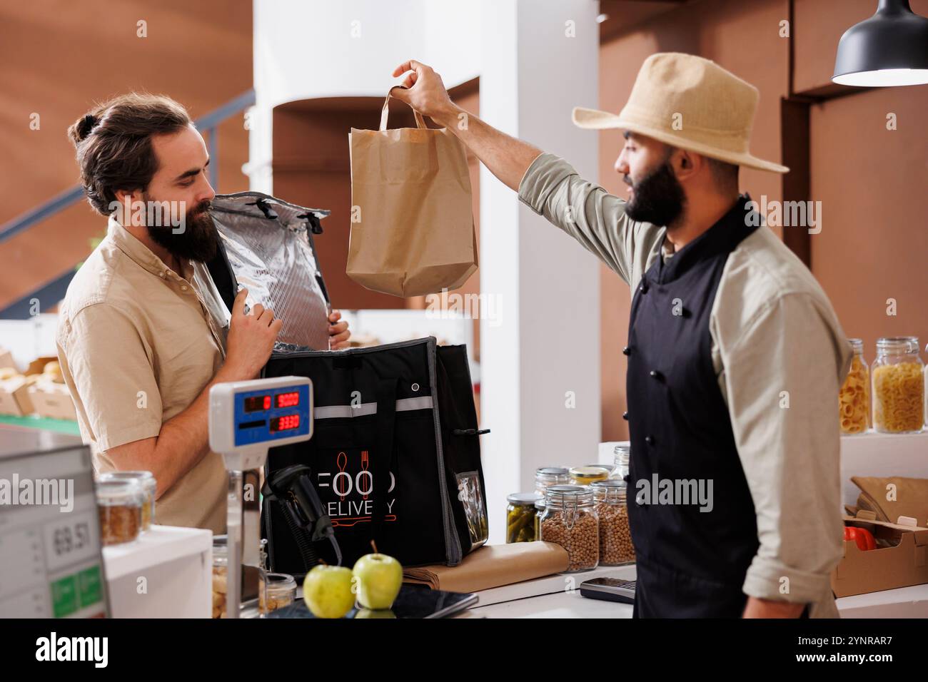 Courier man leaving grocery bag hi-res stock photography and images - Alamy