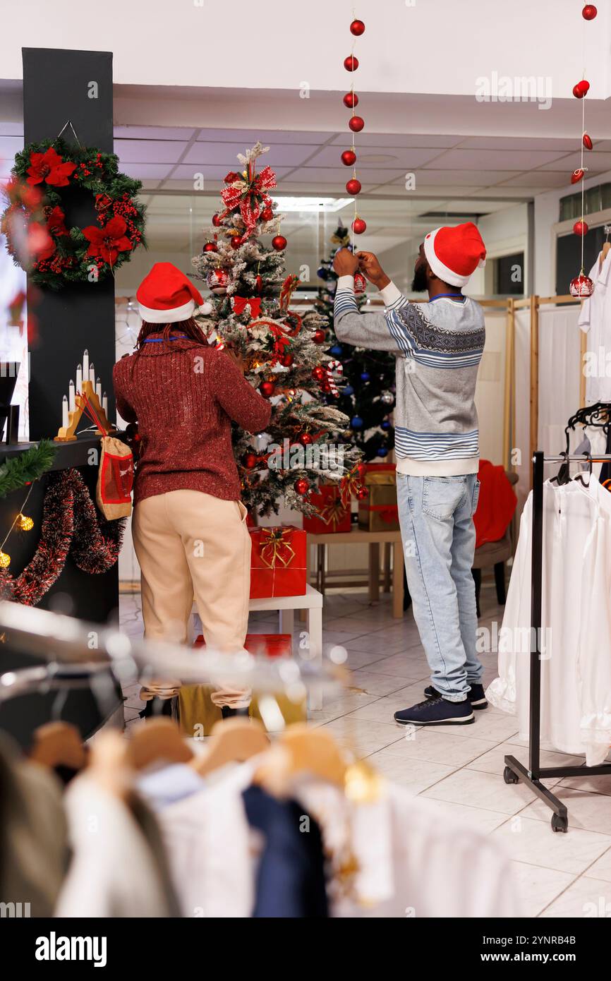 Staff assistant in festive decorated hi-res stock photography and ...