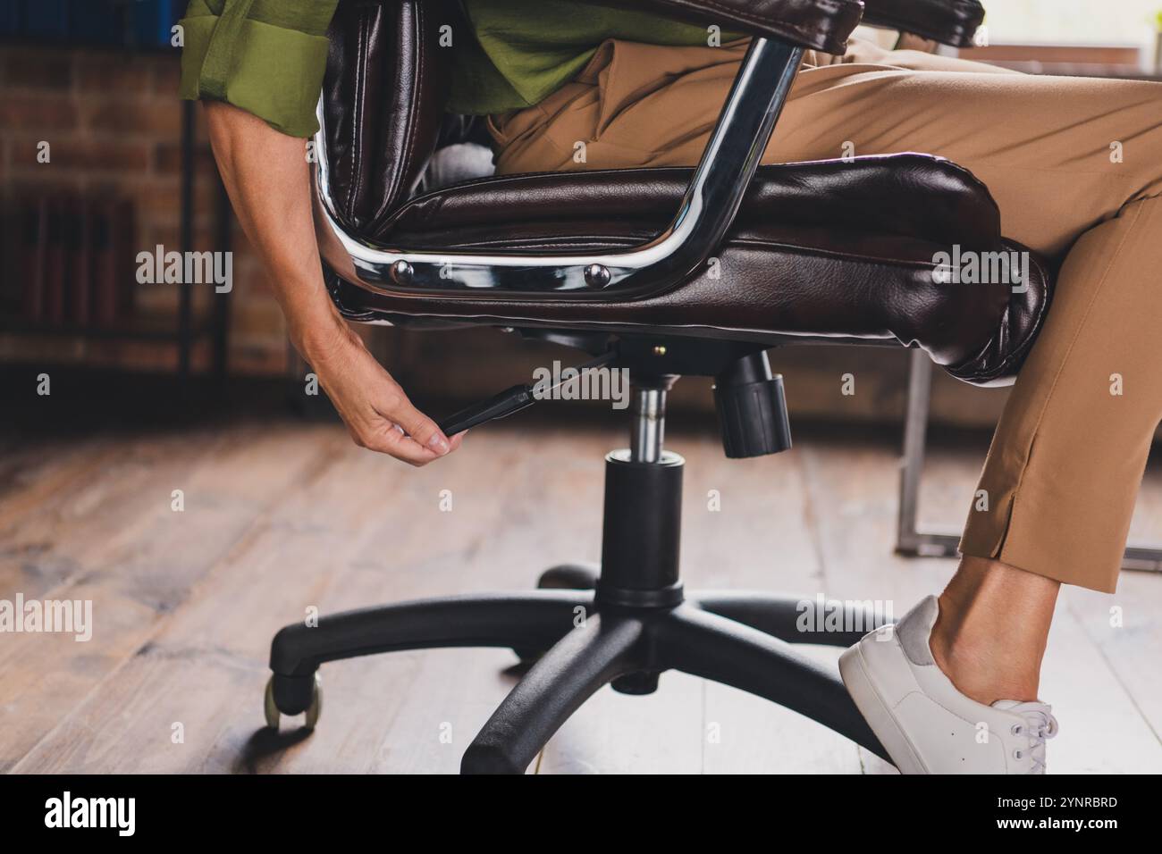 Photo of boss lady sit fix regulate chair workplace workstation loft ...