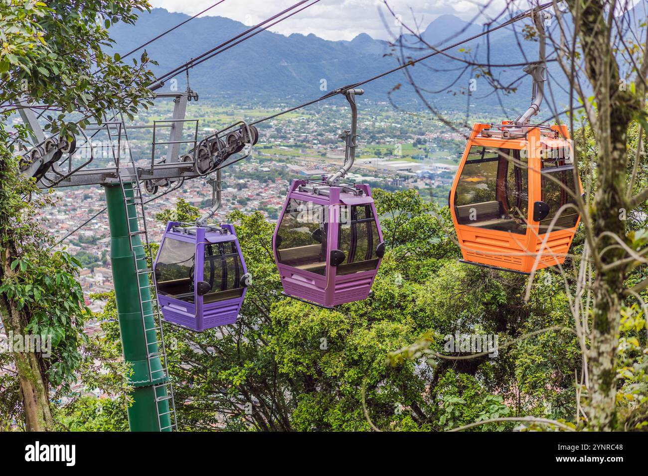 Cable car cabins with a panoramic view of Orizaba from Cerro del ...