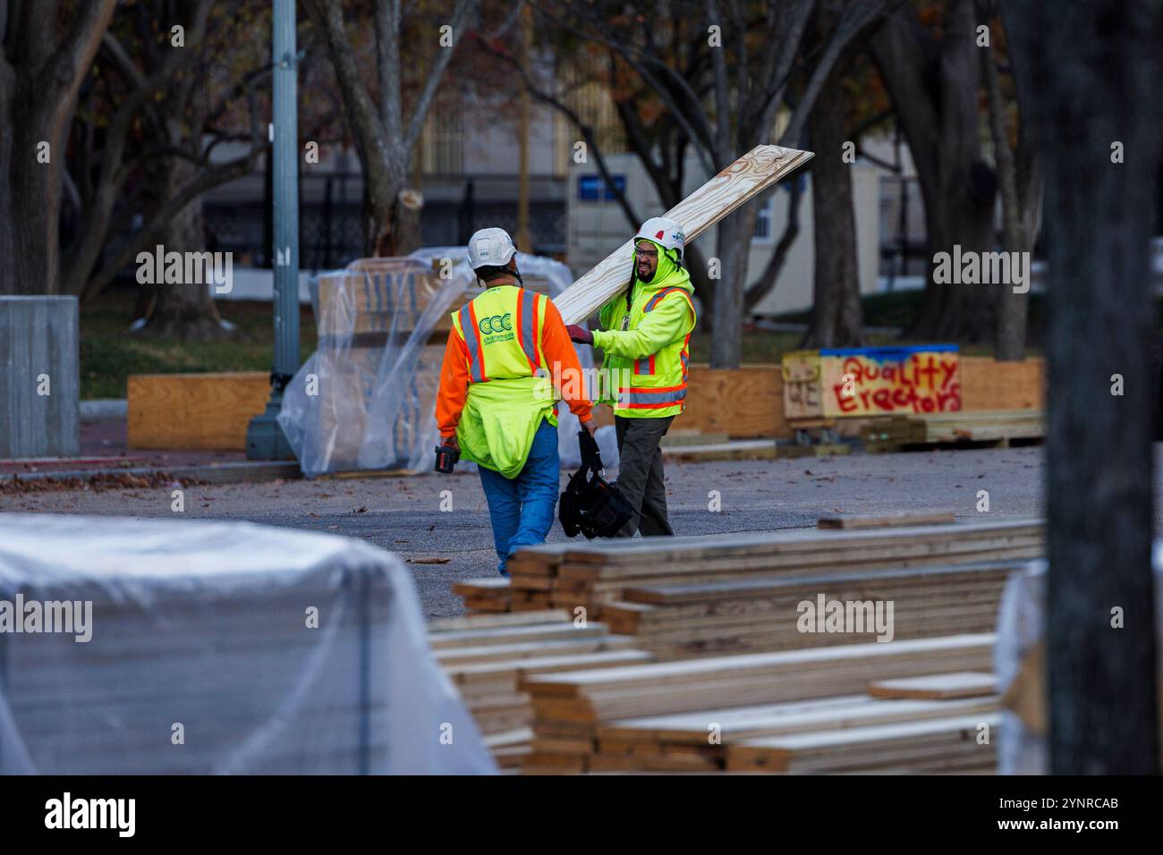 Crews work to construct the Inaugural Parade viewing platform in front ...