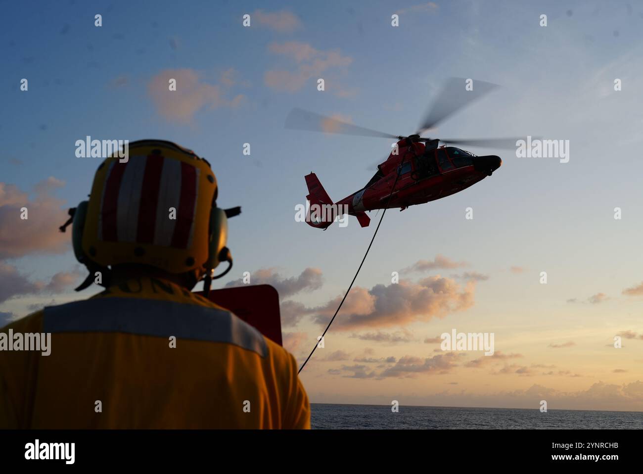 Ensign Jesse Johnson conducts a Helicopter In-Flight Refueling with the ...