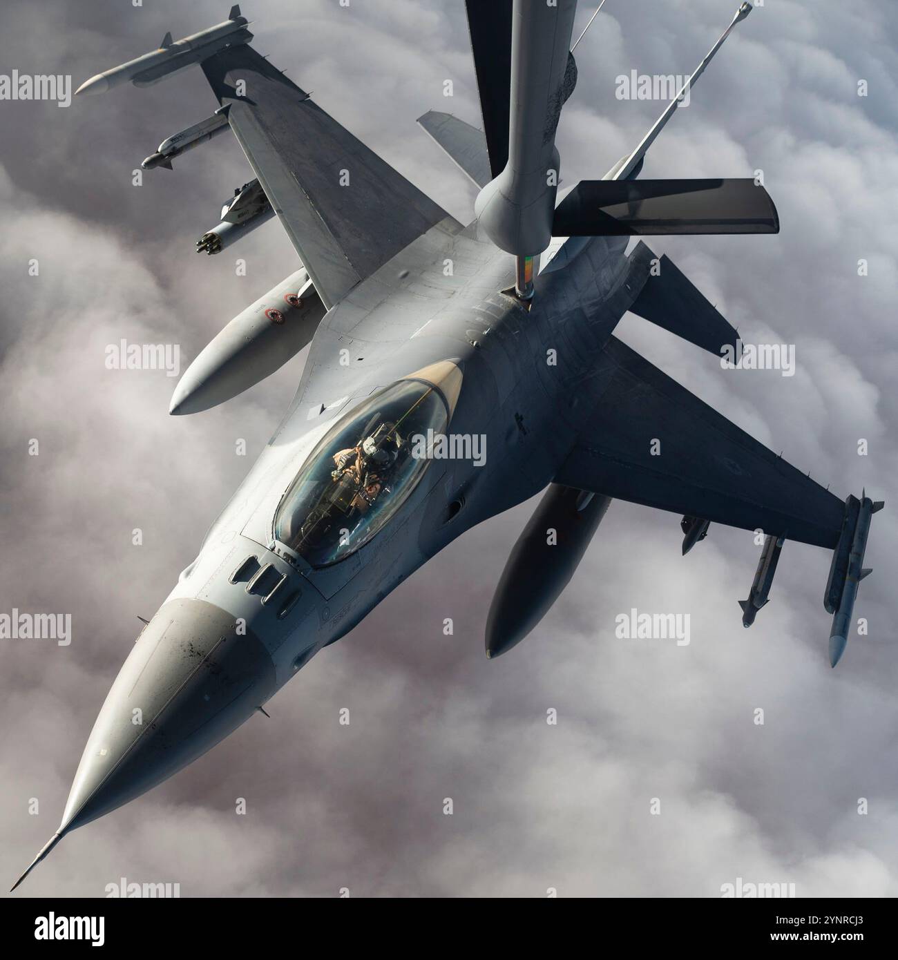 A U.S. Air Force F-16 Fighting Falcon is refueled over the U.S. Central ...