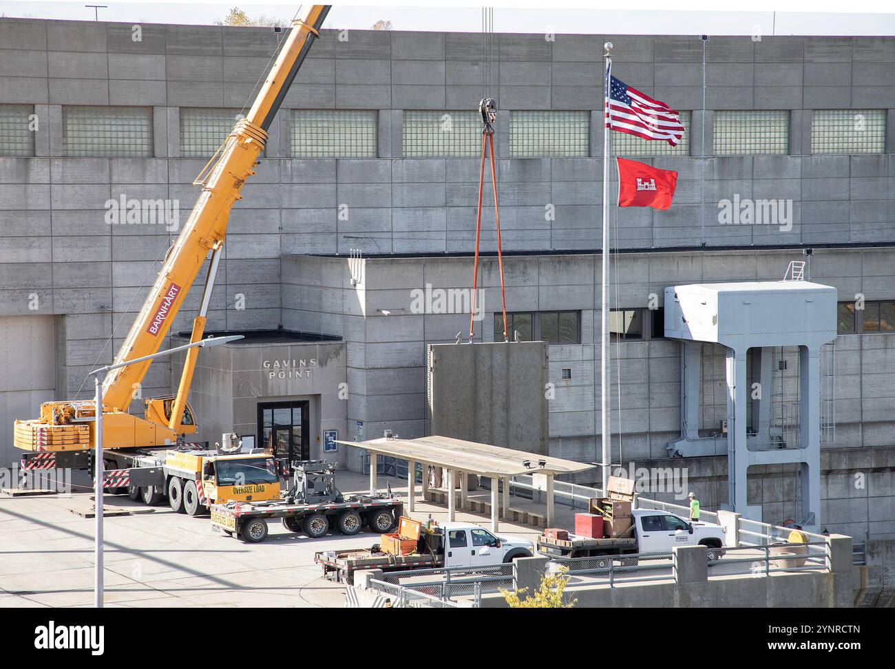 Contractors from Barnhart Crane and Rigging Co. use a mobile crane to ...