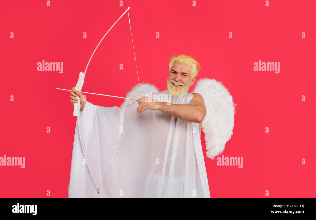 Valentines Day celebration. Bearded man with angel wings shooting arrow ...