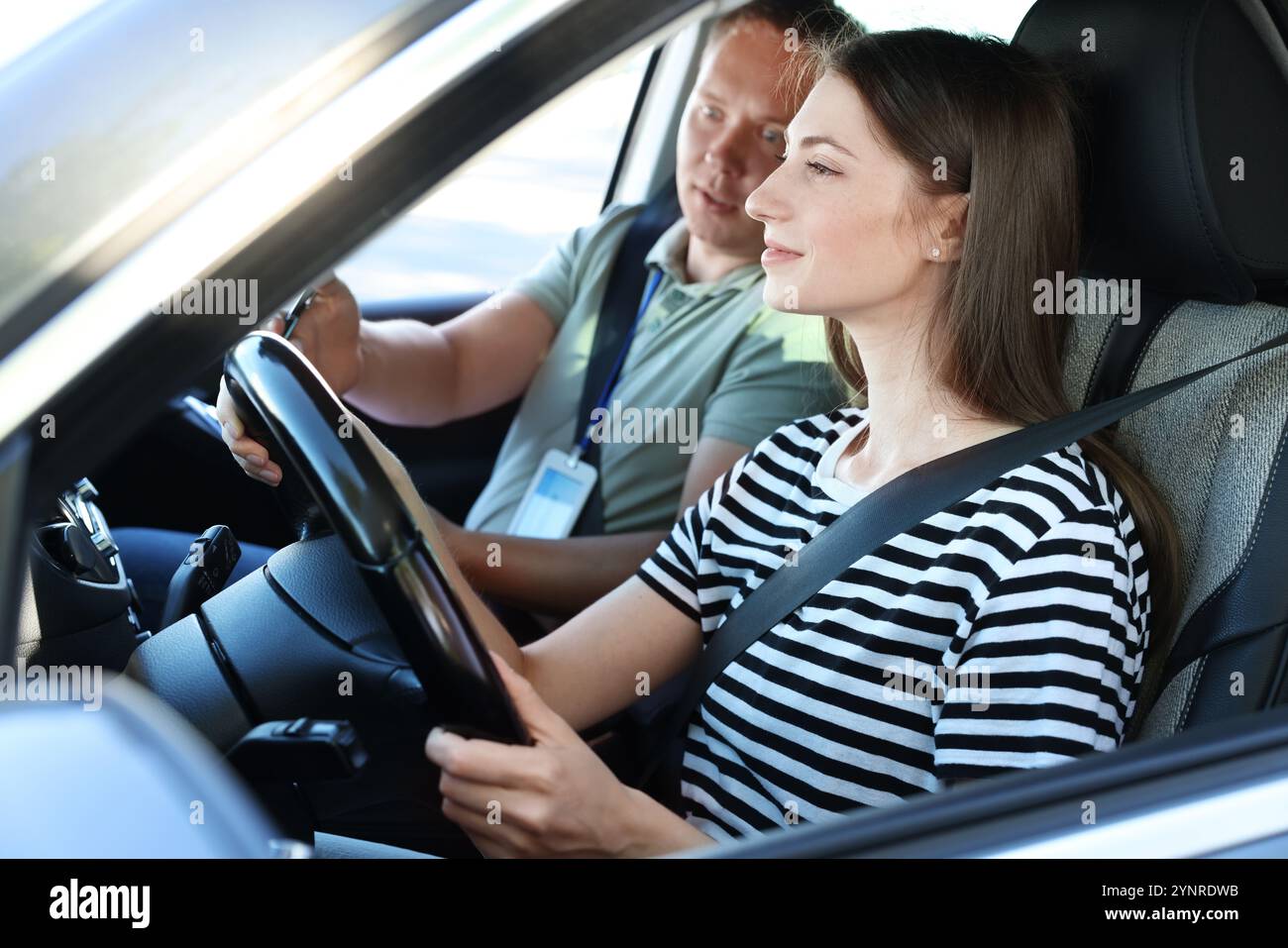 Driving school. Student passing driving test with examiner in car Stock ...