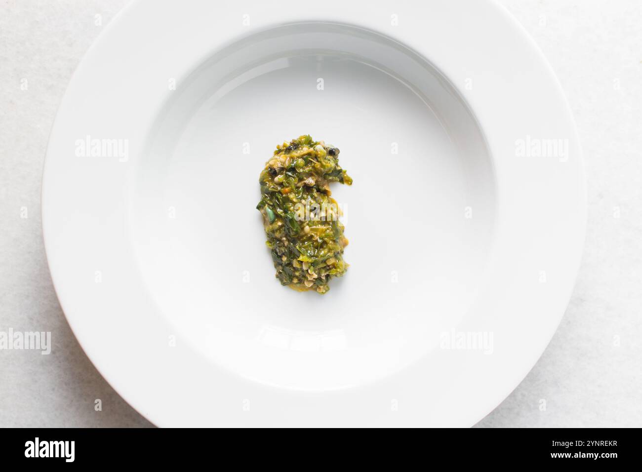 Overhead view of Nigerian okro vegetable soup in a white plate, top ...