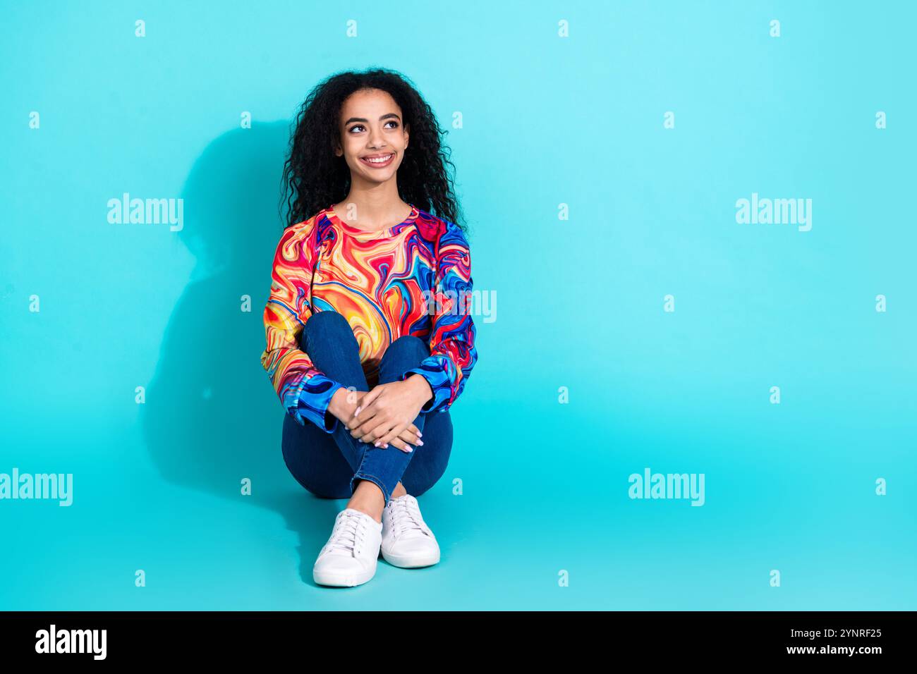 Full size photo of pretty young girl look empty space isolated on teal ...