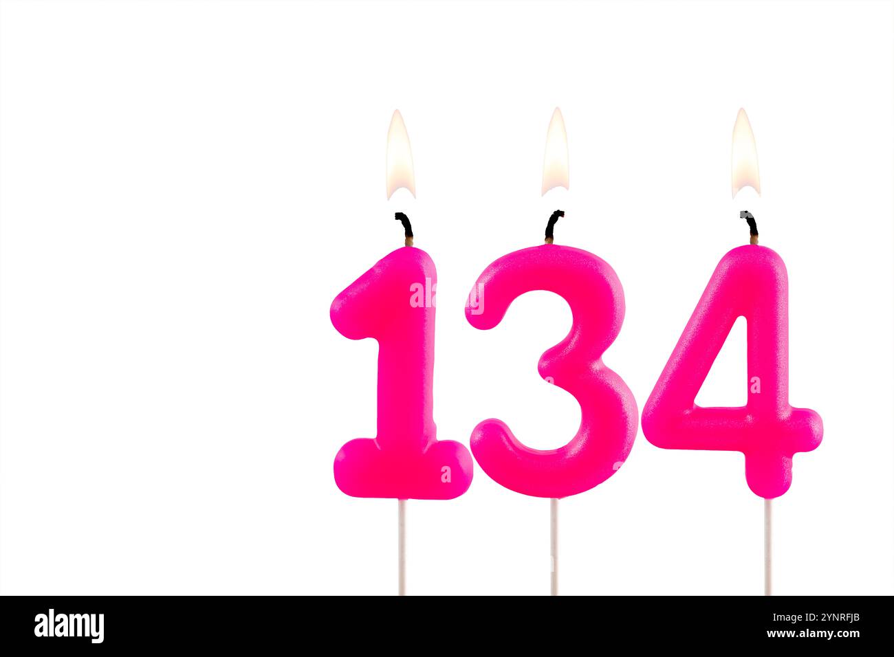 Pink number 134 birthday candle lit on white background Stock Photo - Alamy