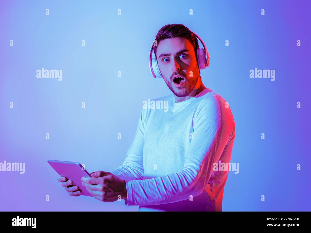 Guy holding tablet emotions hi-res stock photography and images - Alamy