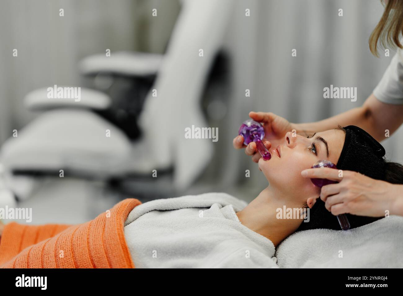 Relaxing skincare treatment in a spa setting with a facial massage ...