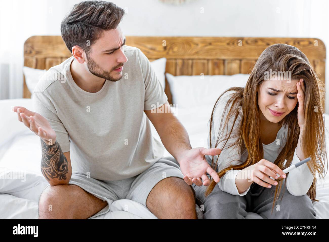 Negative result and disappointment. Sad man gesturing, woman cries ...