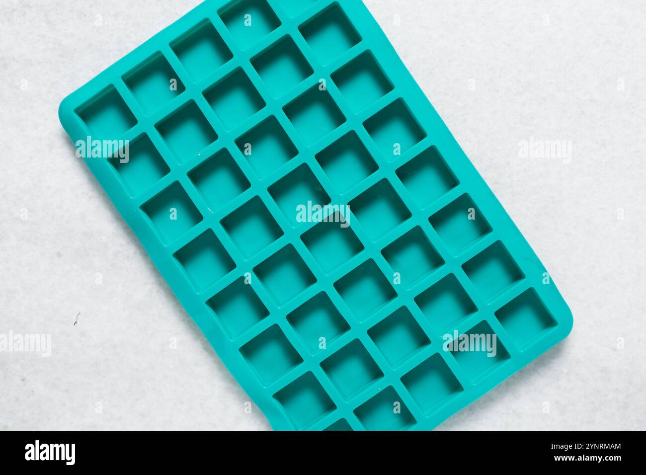 Overhead view of green silicone mold with 40 cavities, top view of ...