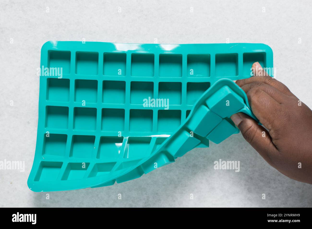 Overhead view of green silicone mold with 40 cavities, top view of ...