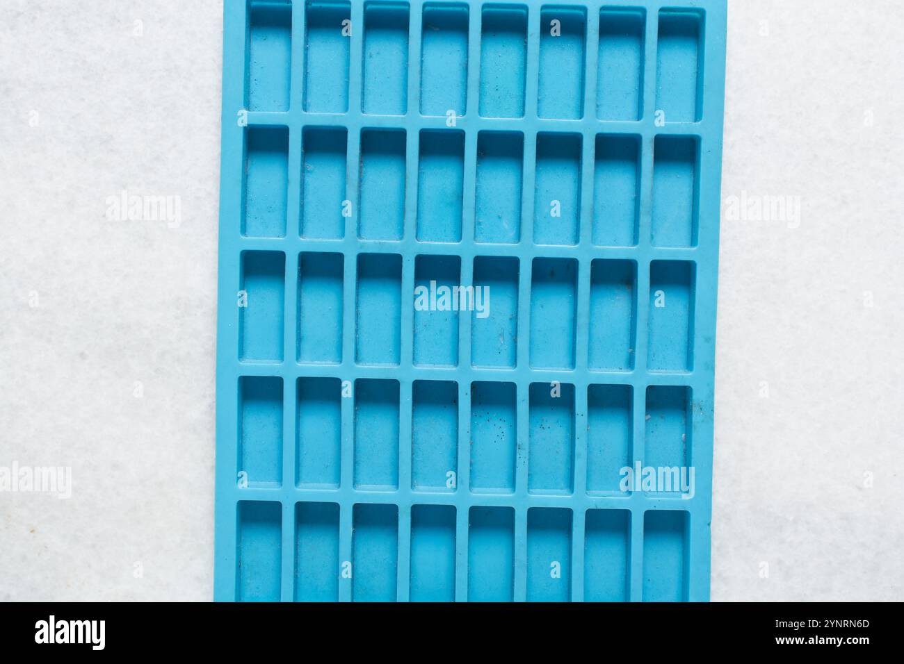 Overhead view of blue silicone mold with 40 cavities, top view of blue ...