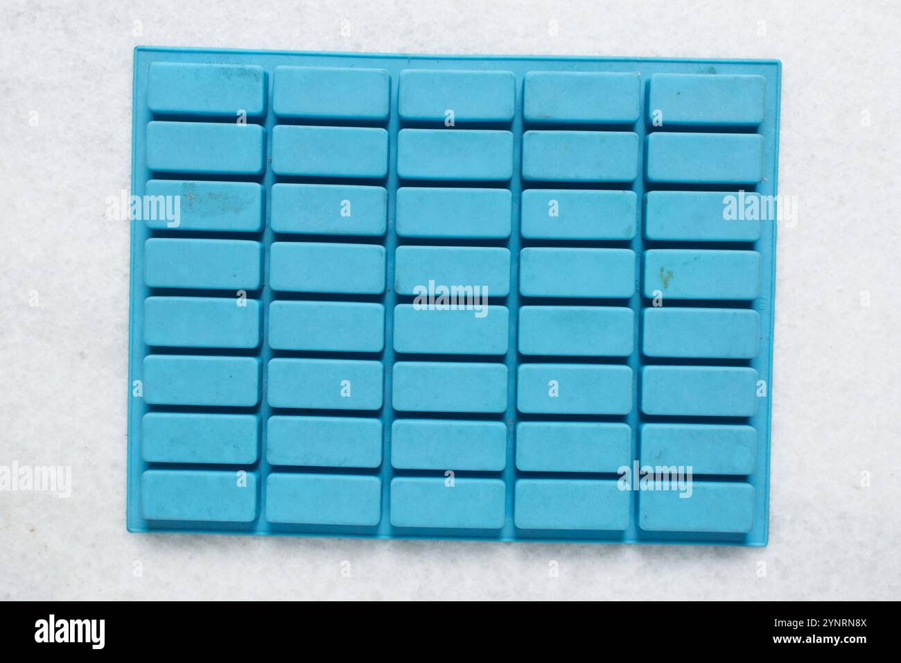 Overhead view of blue silicone mold with 40 cavities, top view of blue ...