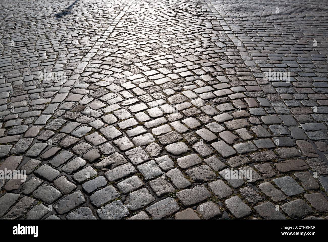 Pavement road. Background of bricks road. Stone cladding pavement ...
