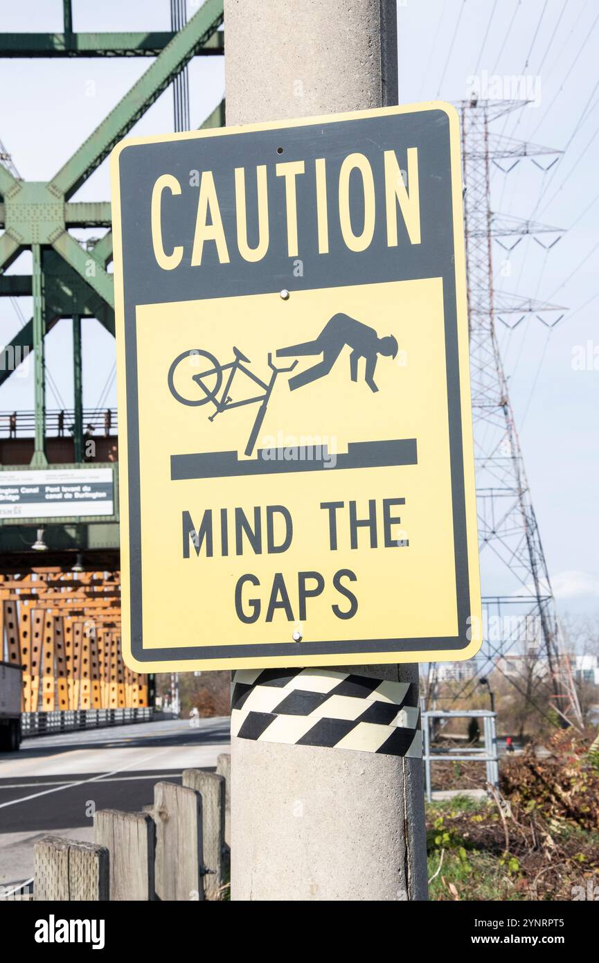 Caution mind the gaps sign on the Burlington Canal Lift Bridge in ...