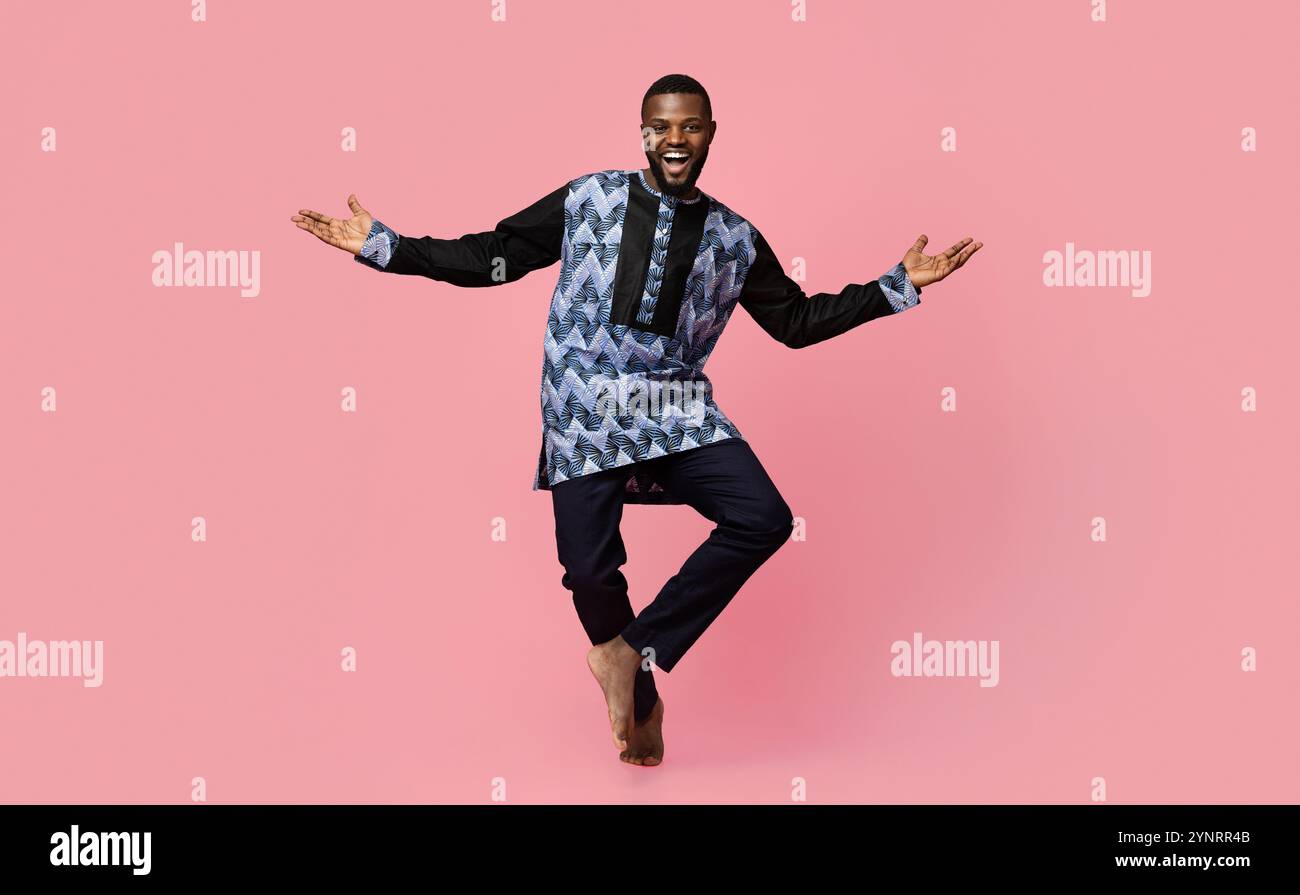 Friendly black man dancing over pink background Stock Photo - Alamy