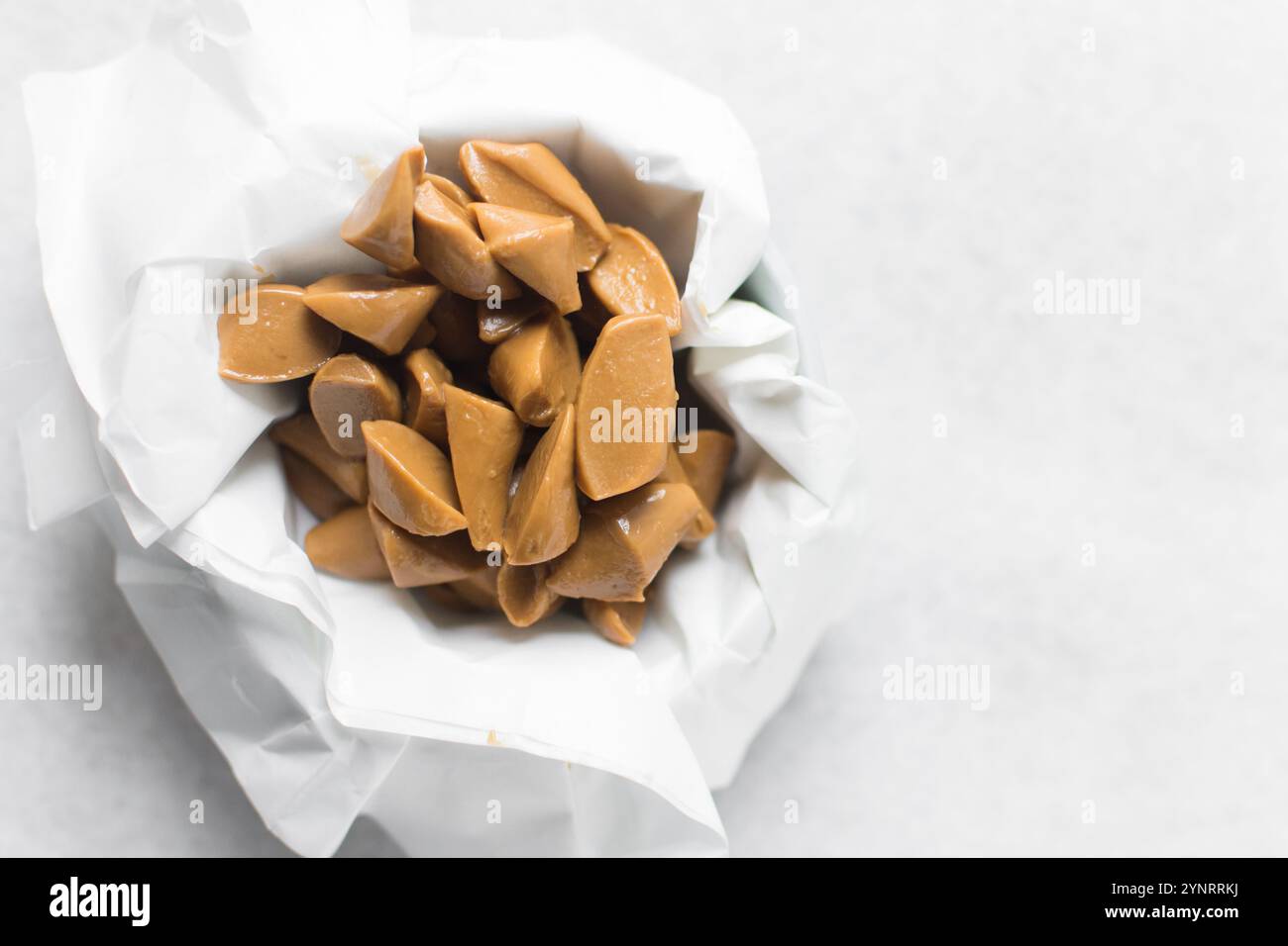 Overhead view of iloka candy on a white plate, top view of cooked ...